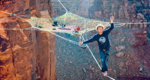 Base jumpers hand knit a spider web of highlines dangling 400 feet ...